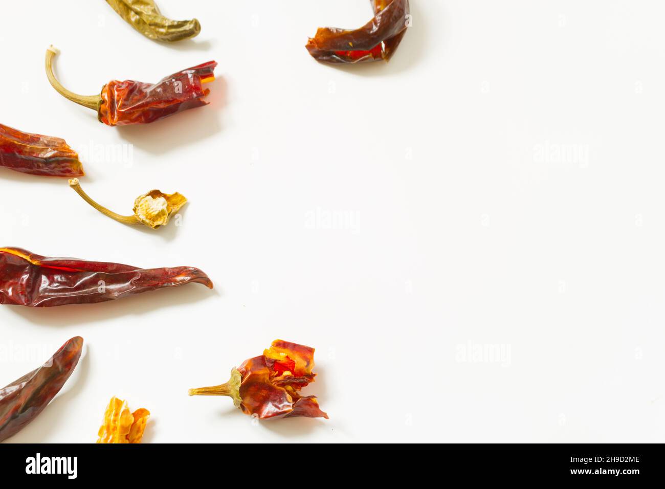 Dry Chilli peppers on white background Stock Photo - Alamy