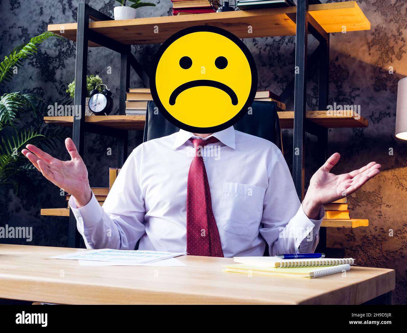 Business failure. Sad businessman with an emoticon instead of a face ...