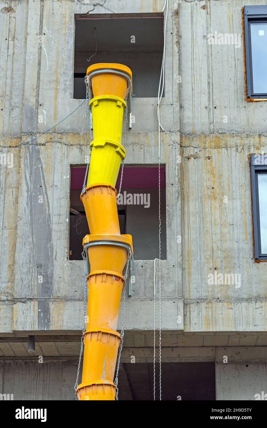 Yellow Plastic Debris Chute at Concrete Building Construction Site ...