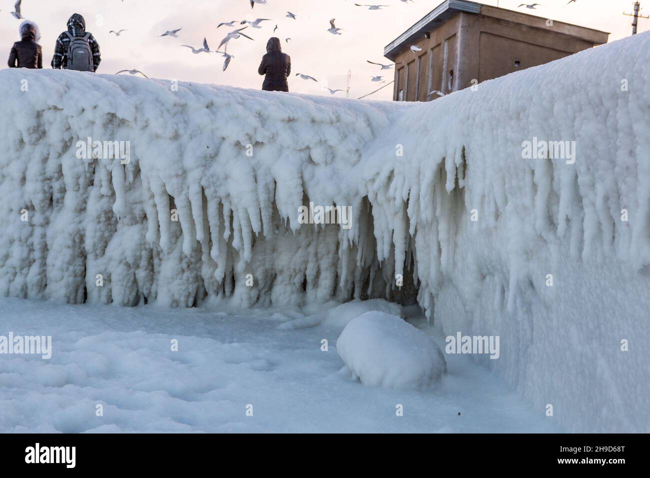 Icing. Winter natural disaster icing sea promenade after winter storm ...