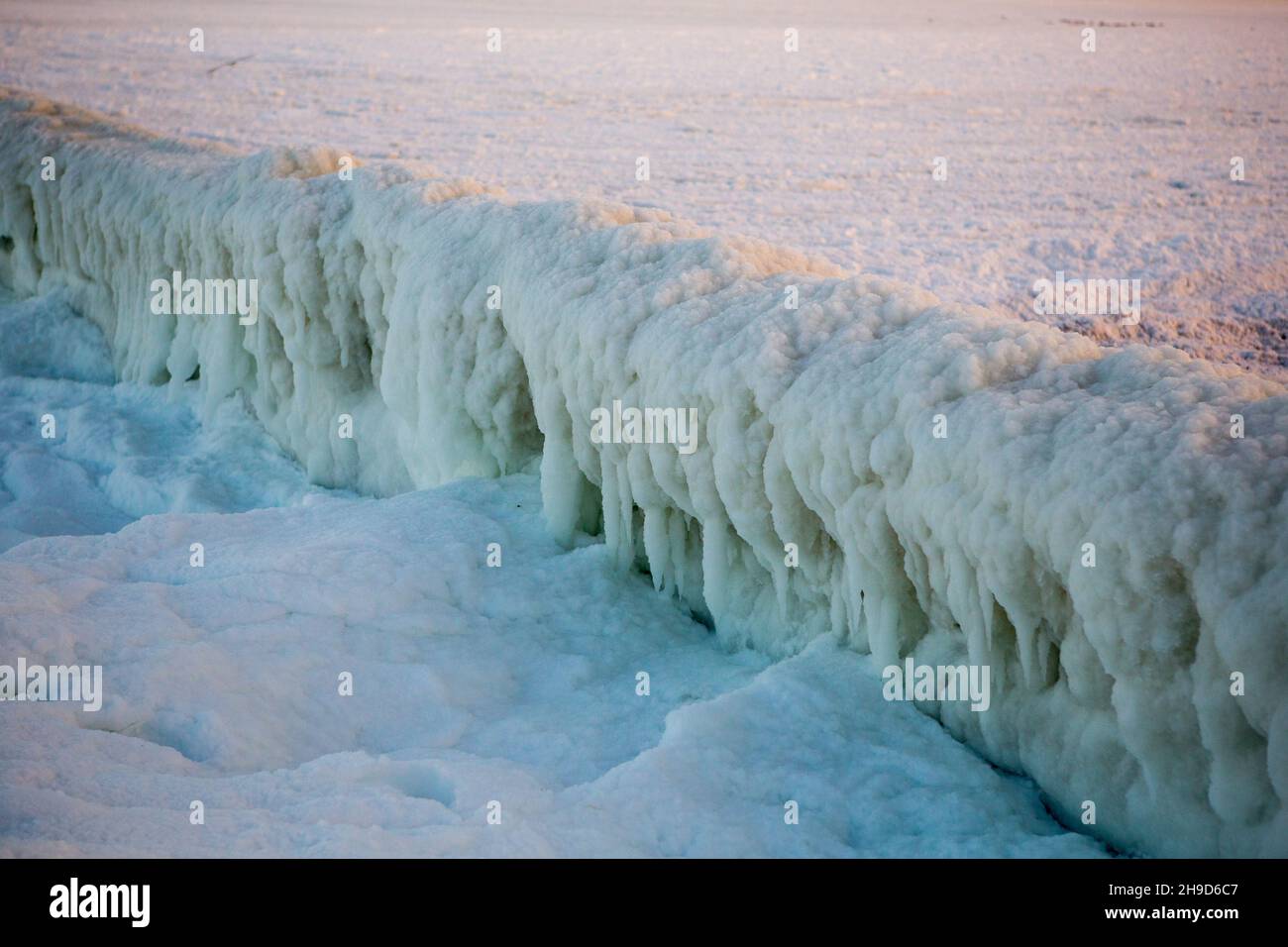 Icing. Winter natural disaster icing sea promenade after winter storm ...
