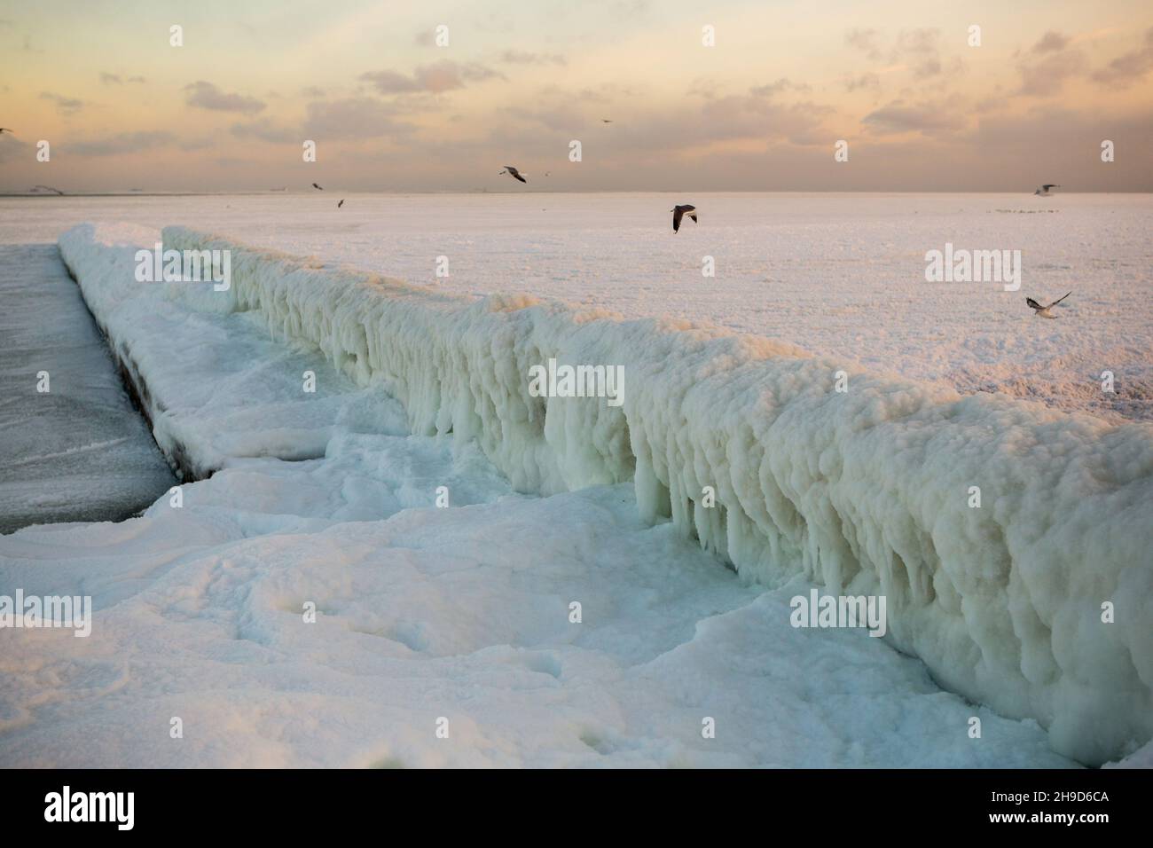 Icing. Winter natural disaster icing sea promenade after winter storm ...