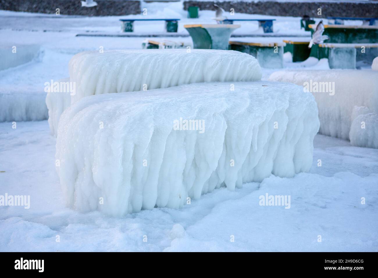 Icing. Winter natural disaster icing sea promenade after winter storm ...