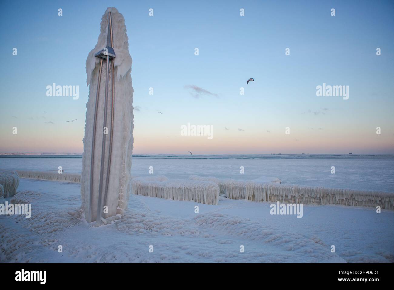 Icing. Winter natural disaster icing sea promenade after winter storm ...