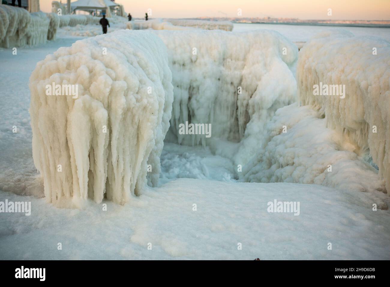 Icing. Winter natural disaster icing sea promenade after winter storm ...