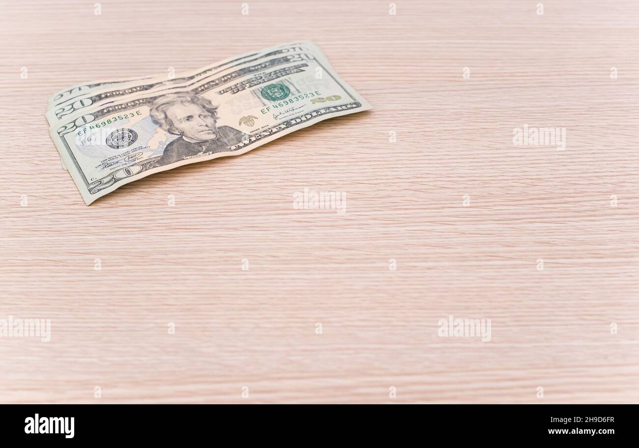 isolated US dollar banknotes on a wooden background with copy space ...