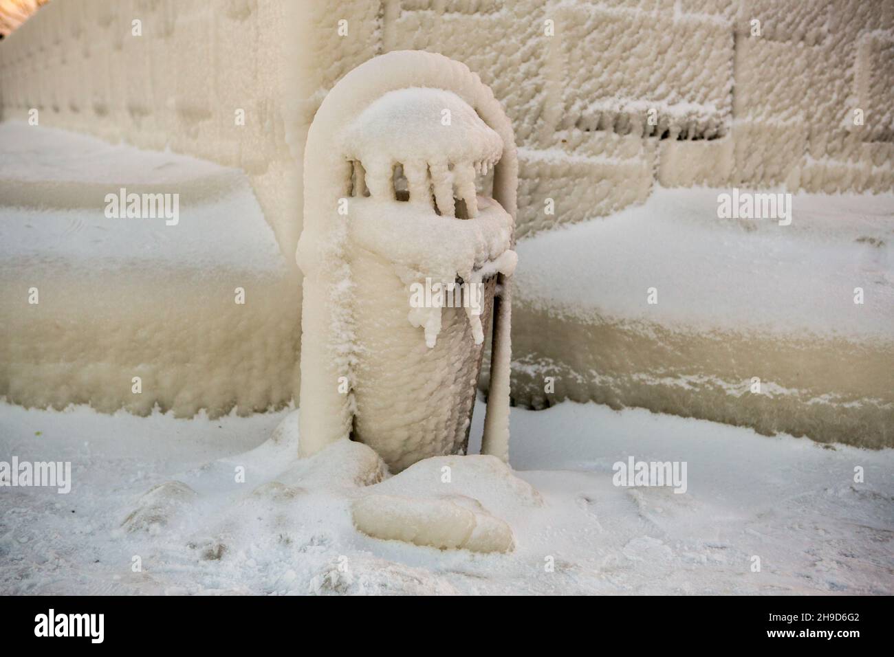 Icing. Winter natural disaster icing sea promenade after winter storm ...