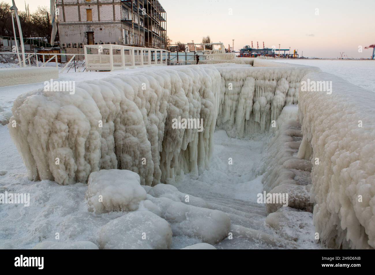 Icing. Winter natural disaster icing sea promenade after winter storm ...