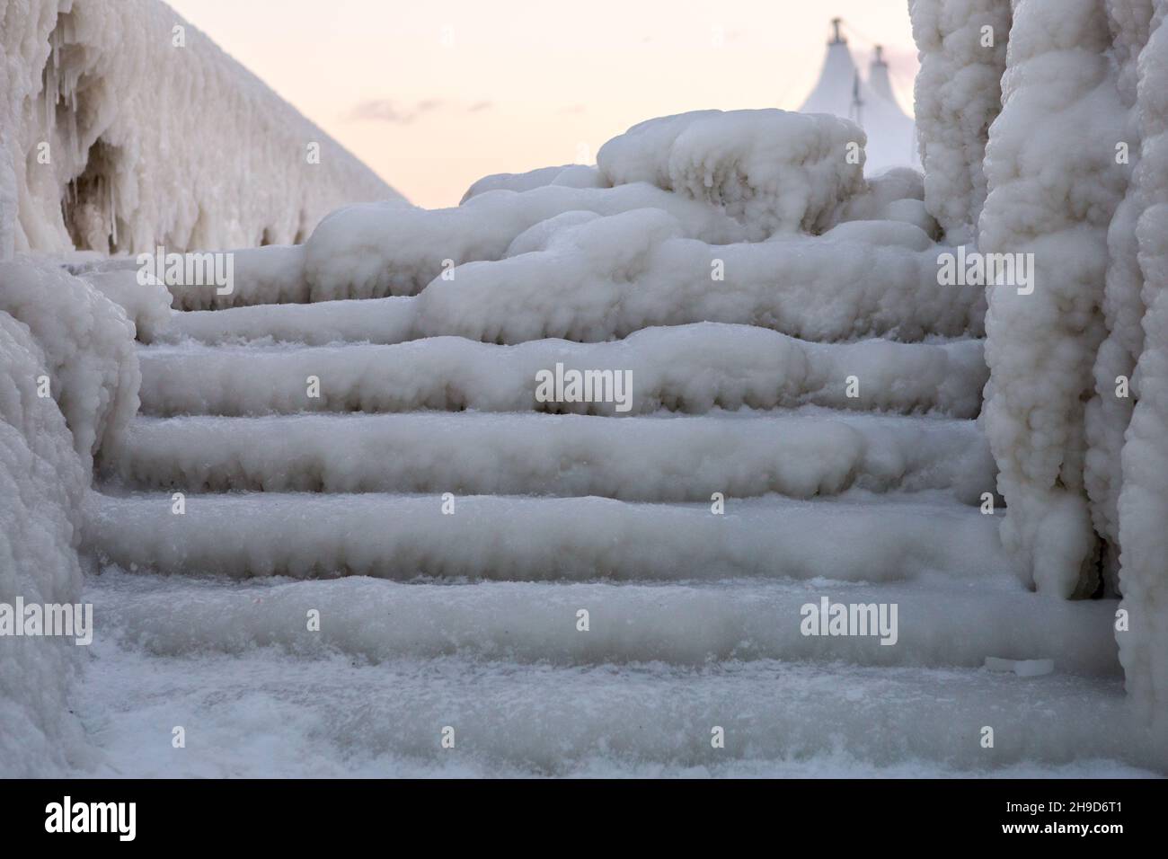 Icing. Winter natural disaster icing sea promenade after winter storm ...