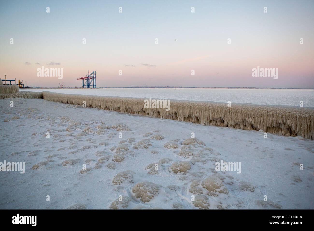Icing. Winter natural disaster icing sea promenade after winter storm ...
