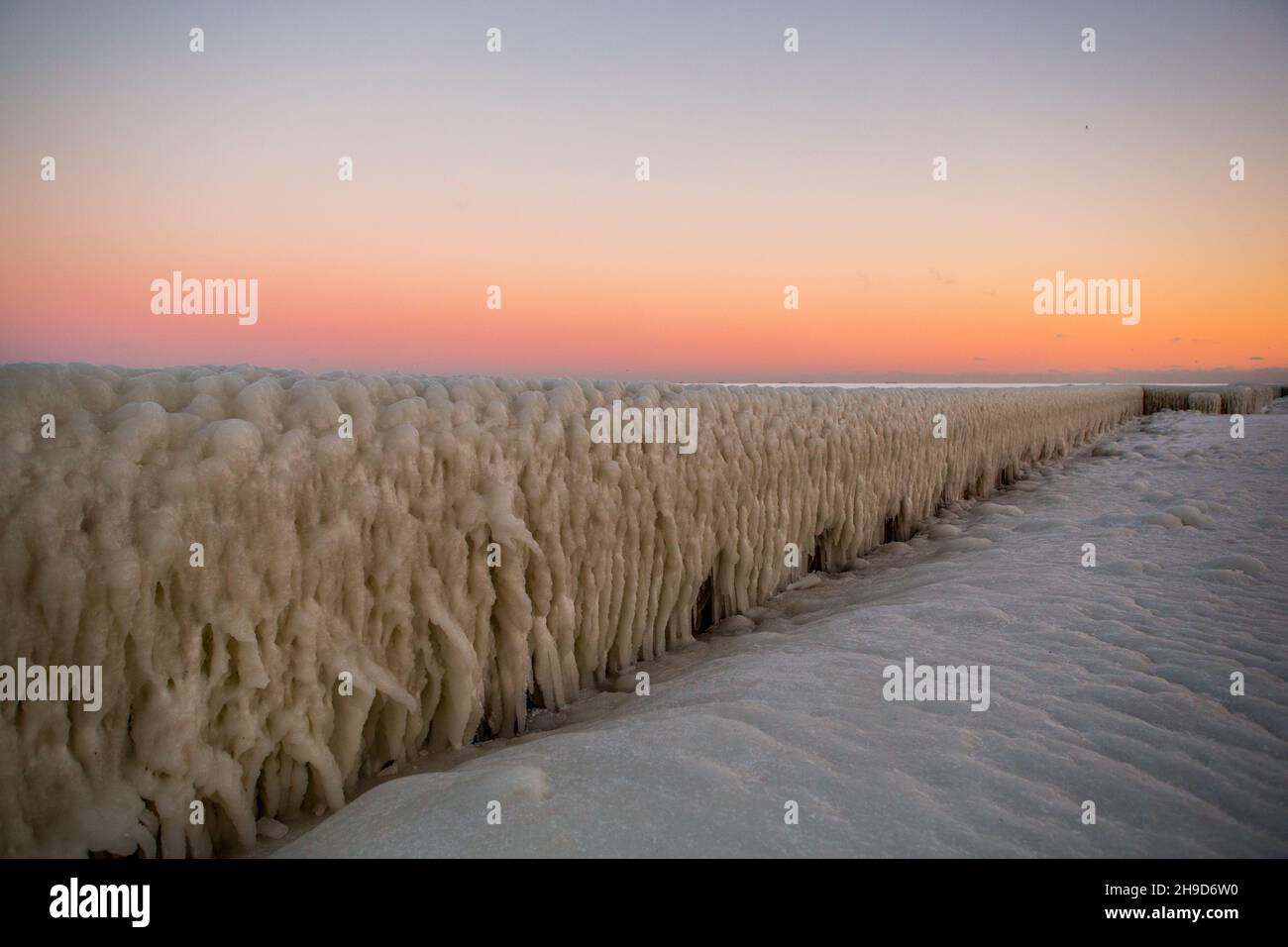 Icing. Winter natural disaster icing sea promenade after winter storm ...