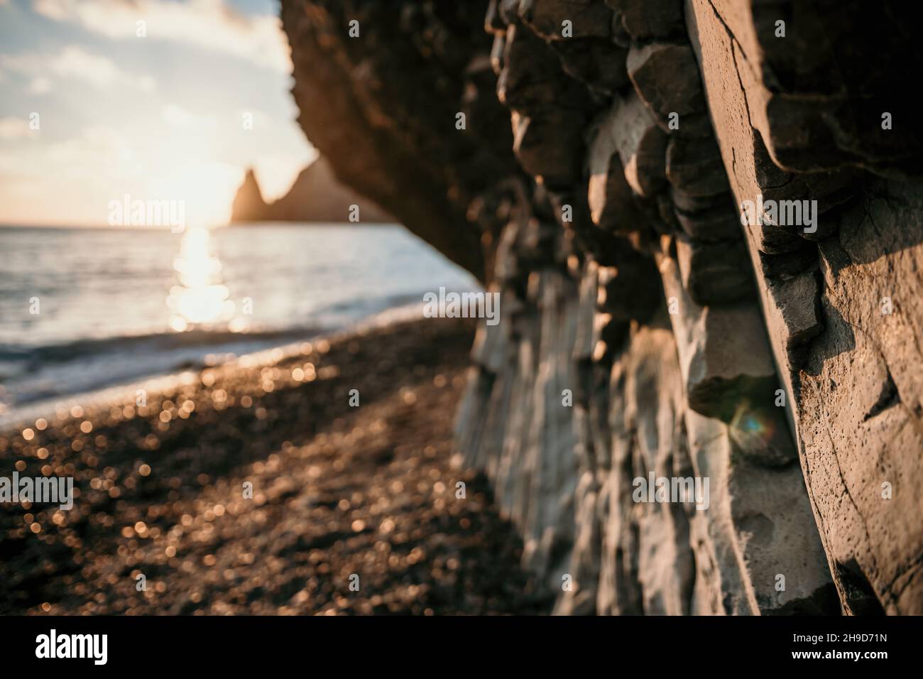 Dramatic Seascape over the beach during sunset, with rocky volcanic ...