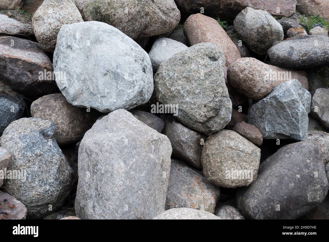 Rockfall on the road in the mountains. Stones of different sizes ...