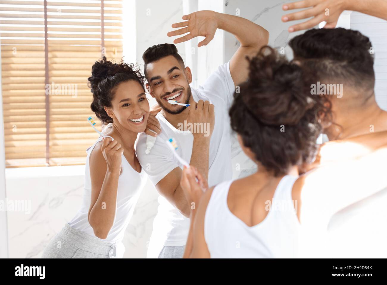 Morning Hygiene. Joyful Middle Eastern Couple Brushing Teeth And ...