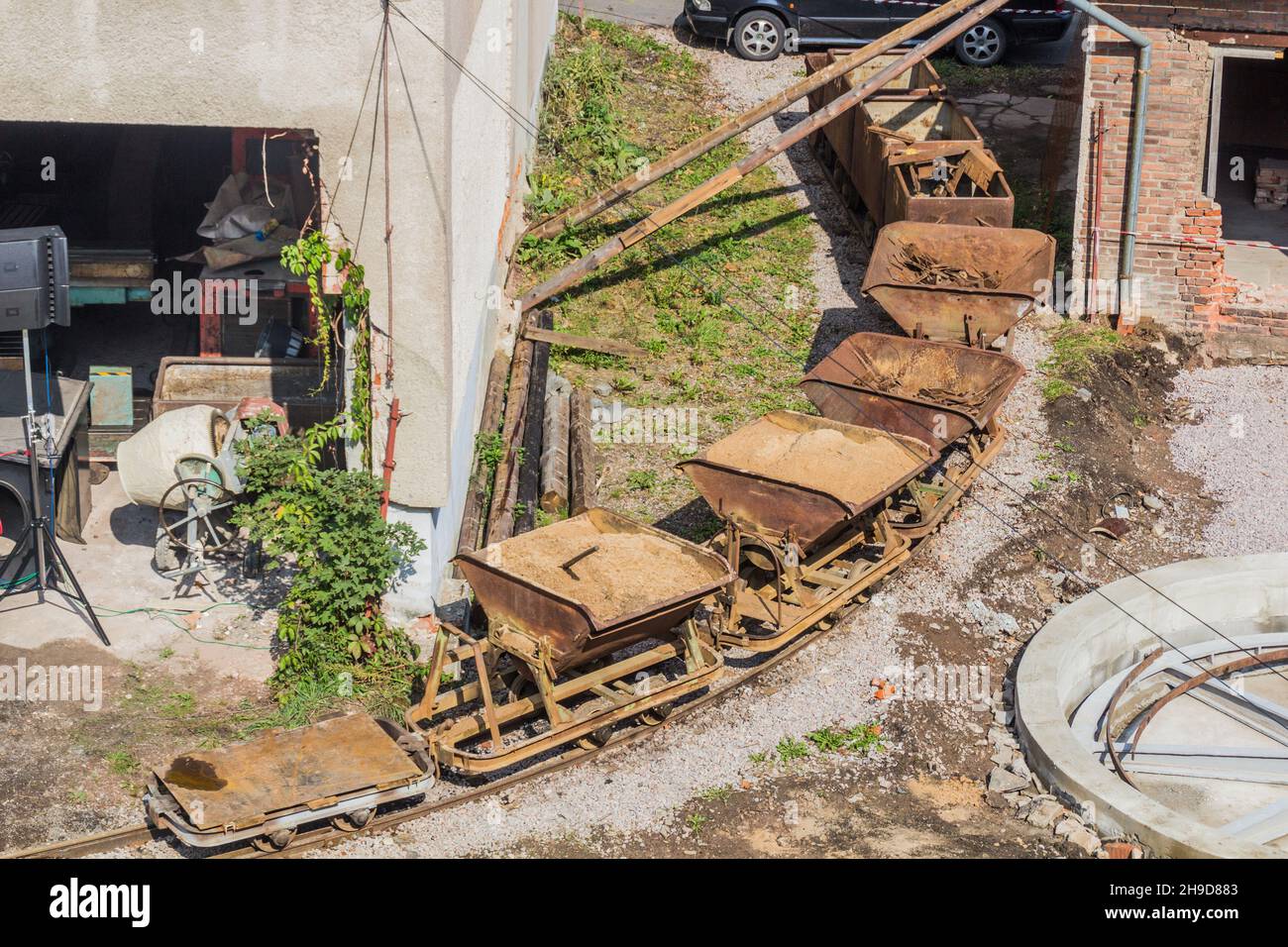 Small railroad hopper cars in an old factory Stock Photo - Alamy