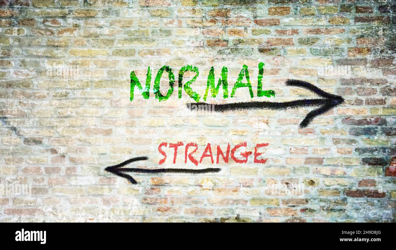 Street Sign the Direction Way to Normal versus Strange Stock Photo - Alamy