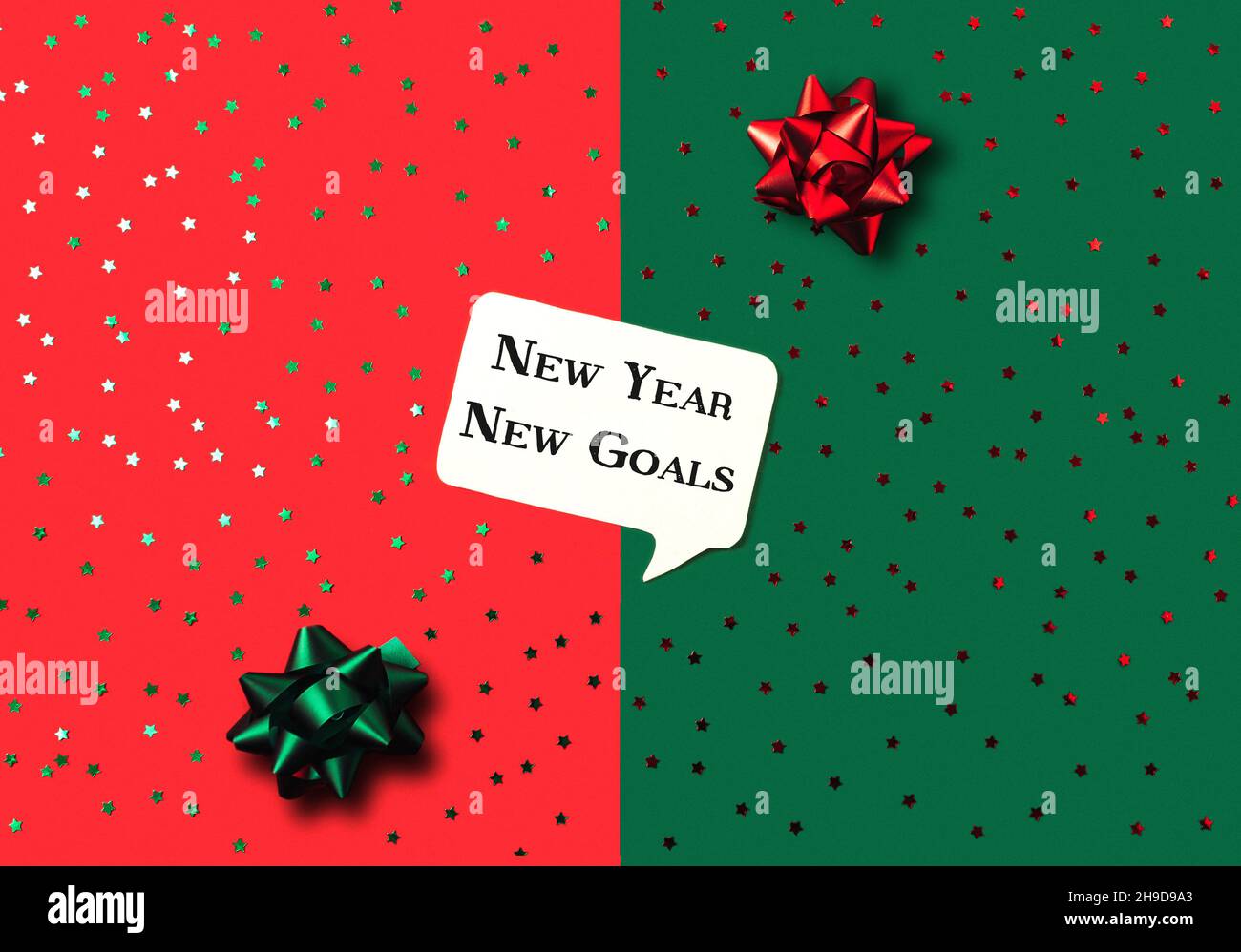 New Year New Goals written on a template for the text, on a red-green ...