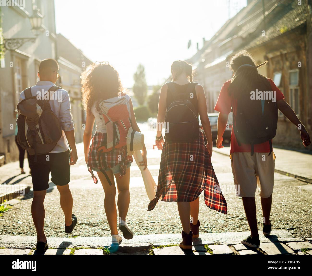 Friends walking down the street hi-res stock photography and images - Alamy