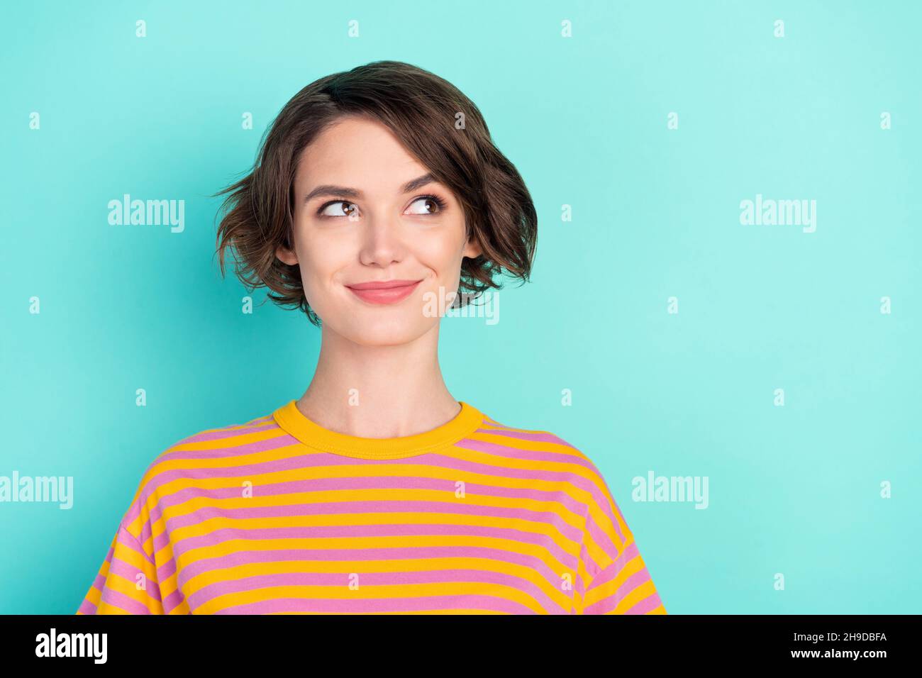 Portrait of attractive cheery brainy girlish minded girl thinking copy ...