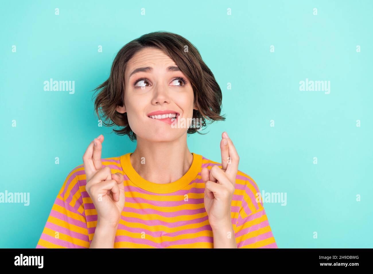 Photo Of Cute Unsure Young Woman Dressed Striped T Shirt Fingers