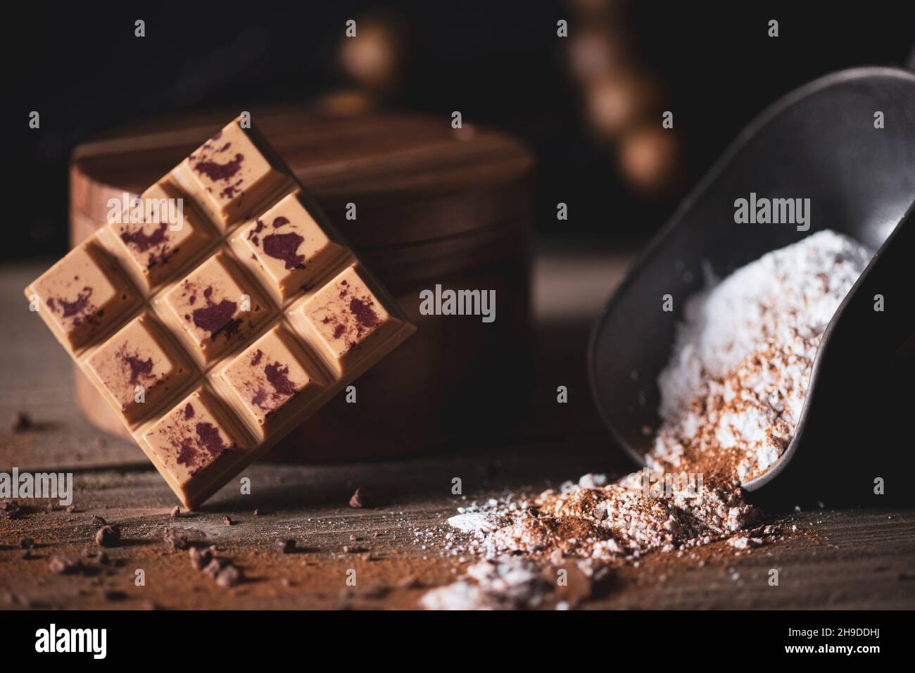 Chocolate bar leaning with Powder Sugar and Cinnamon Stock Photo - Alamy
