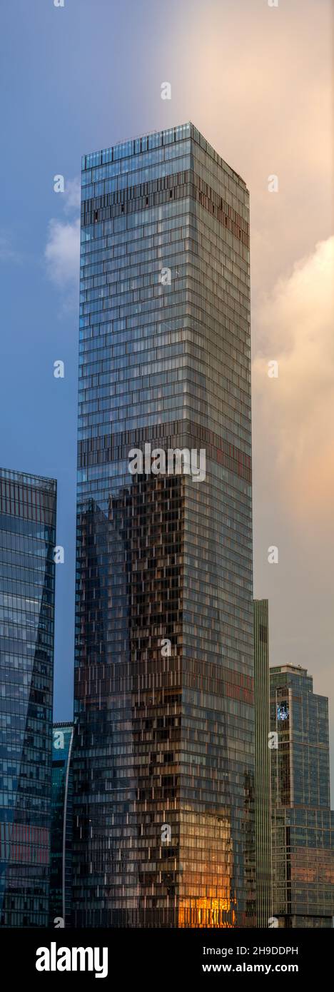 Glazed building with sunset reflection Stock Photo - Alamy