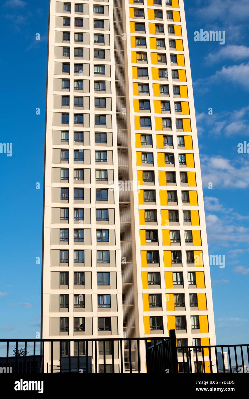 Modern building in a blue sky with clouds Stock Photo - Alamy