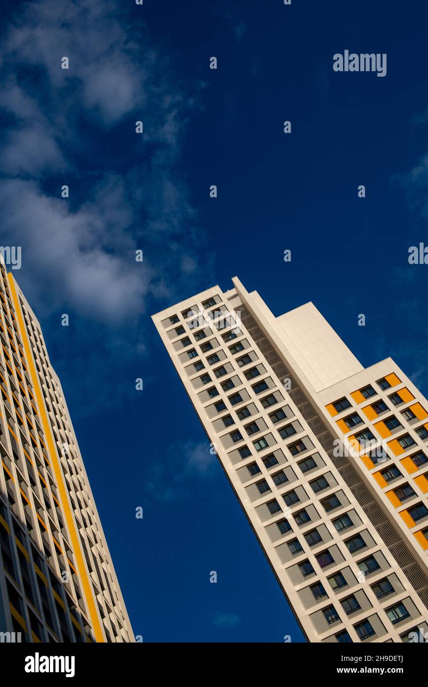 Modern building in a blue sky with clouds Stock Photo - Alamy