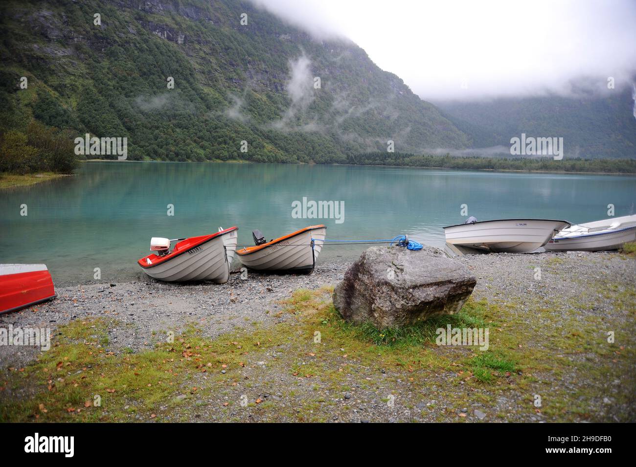 Small boats on the shore line of Lovatnet / Lake Loen Stock Photo - Alamy