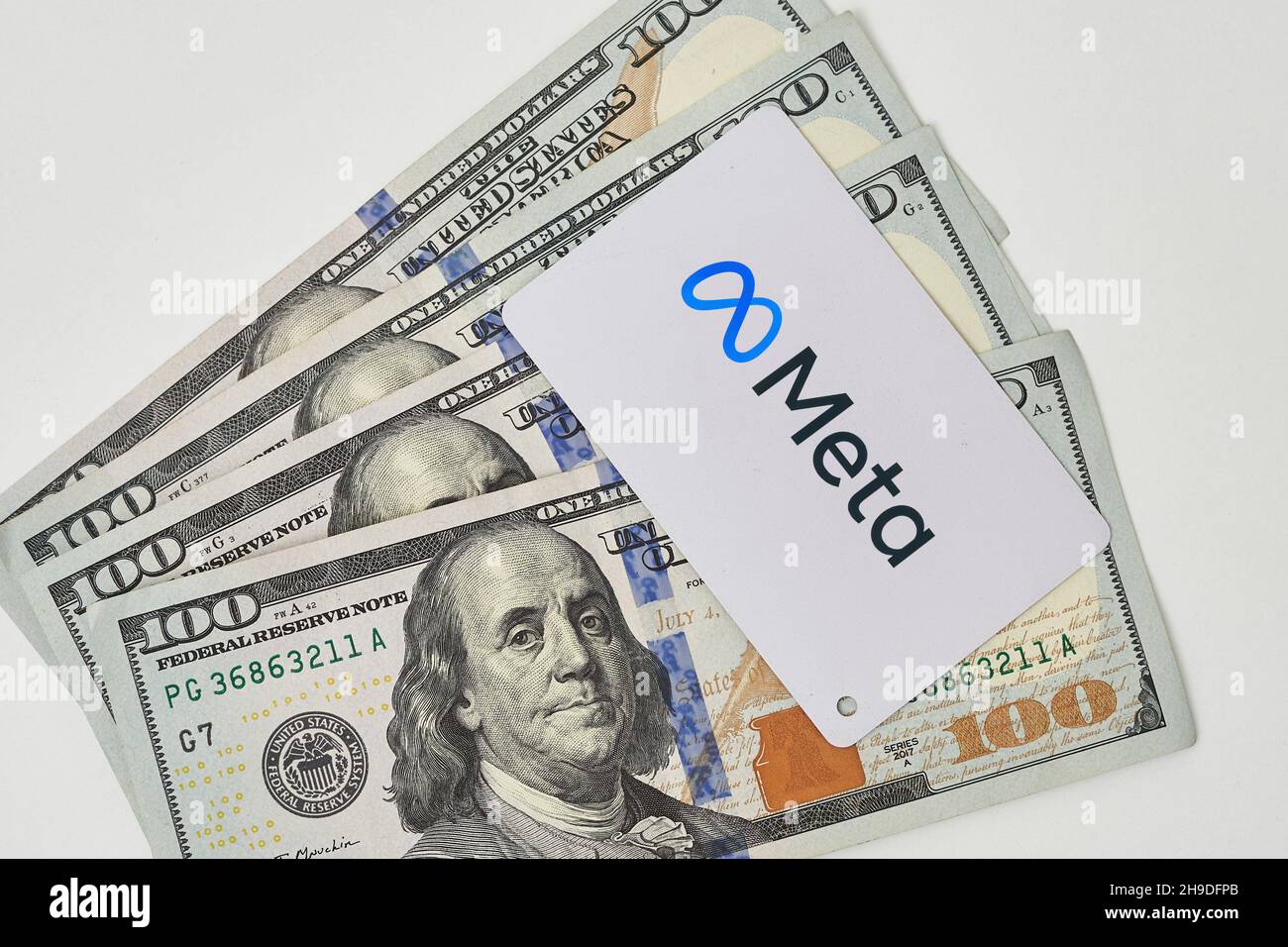 Tashkent, Uzbekistan - 22 November, 2021: Pile of us dollars and Meta ...