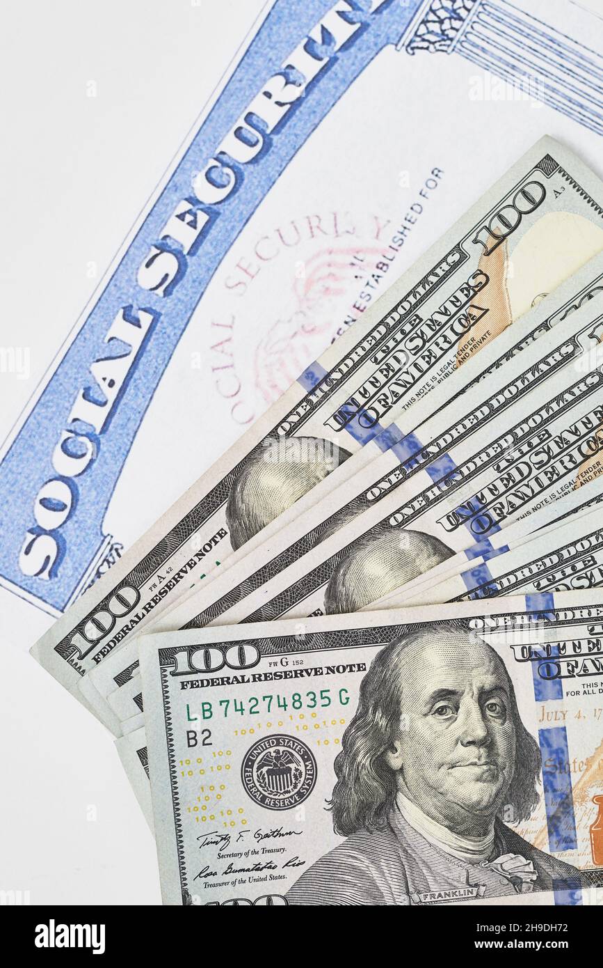 Social security card and us dollars cash money on white. Social ...