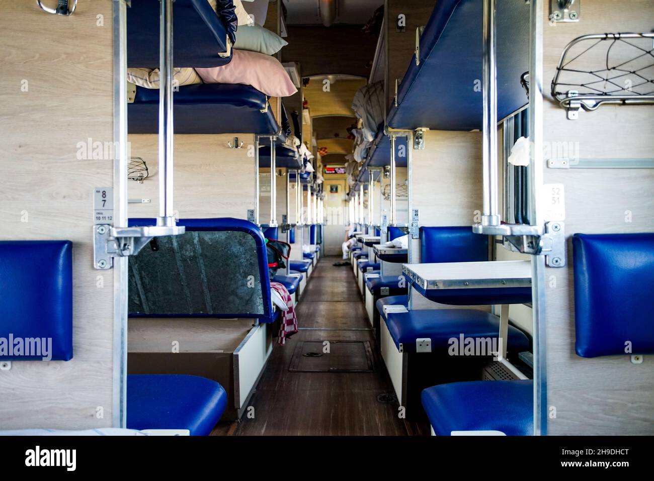 Interior of a typical russian long-distance RZD train with beds for ...