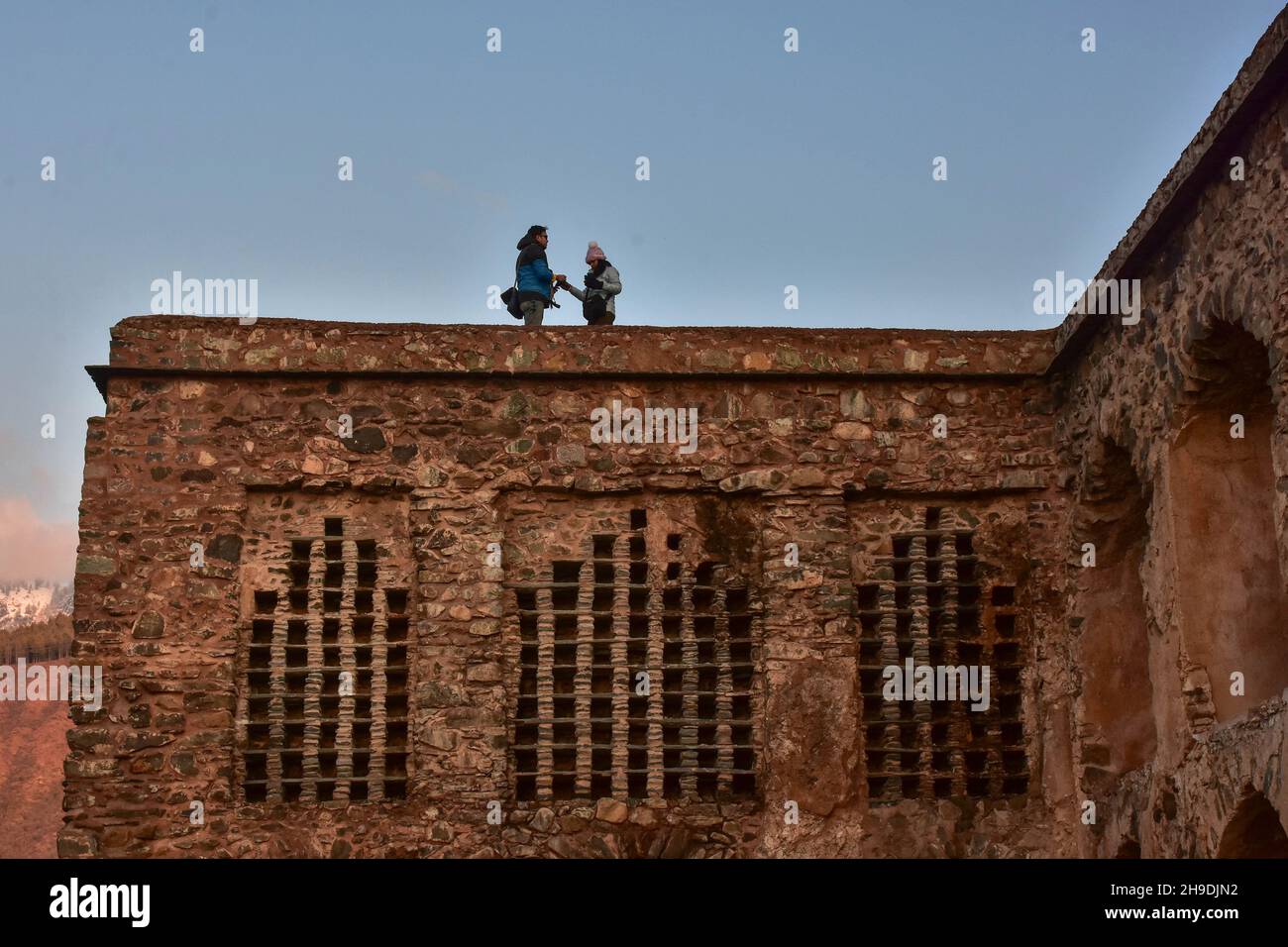 Srinagar, India. 06th Dec, 2021. An Indian tourist couple explores the ...