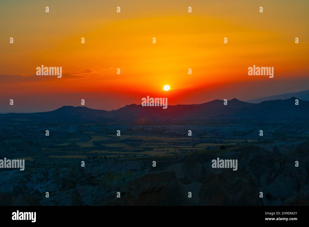 Sunset over the mountains. Sunset scene with silhouettes of mountains ...