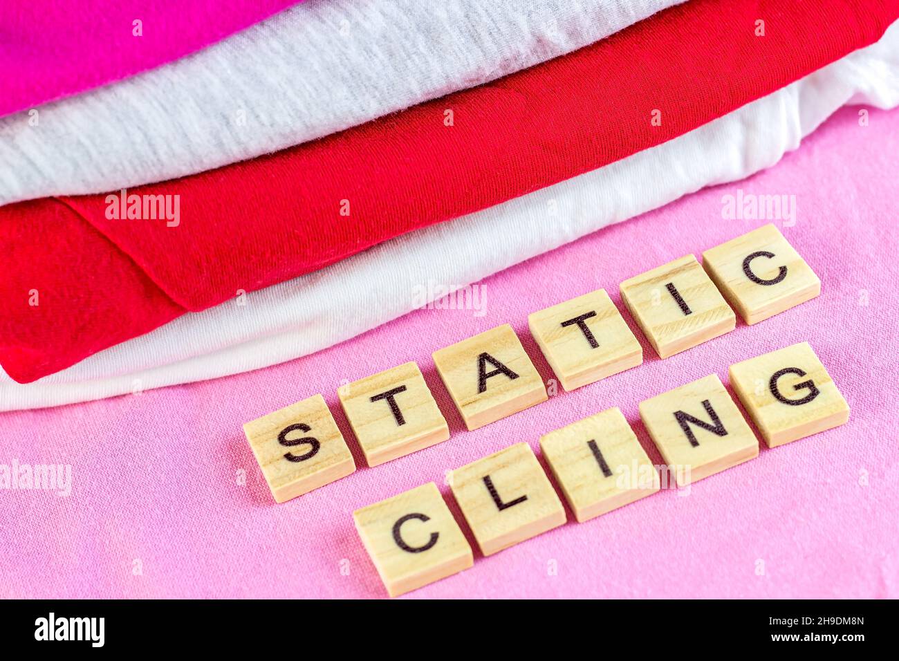 Bright dry stack of clothes with wooden words Static Cling Stock Photo ...