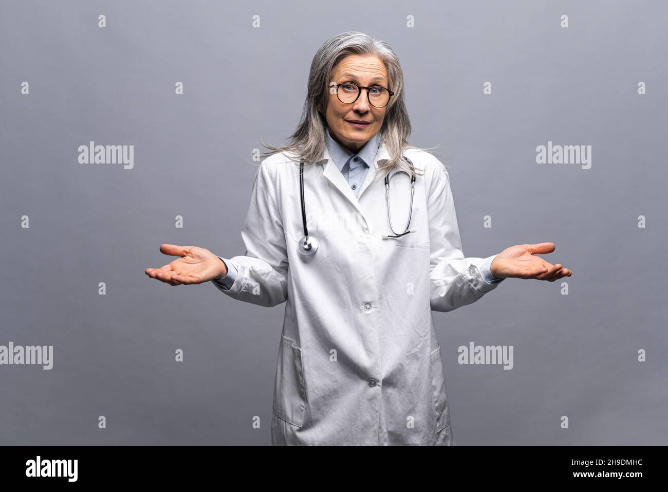 Confused healthcare doctor standing looking hi-res stock photography ...