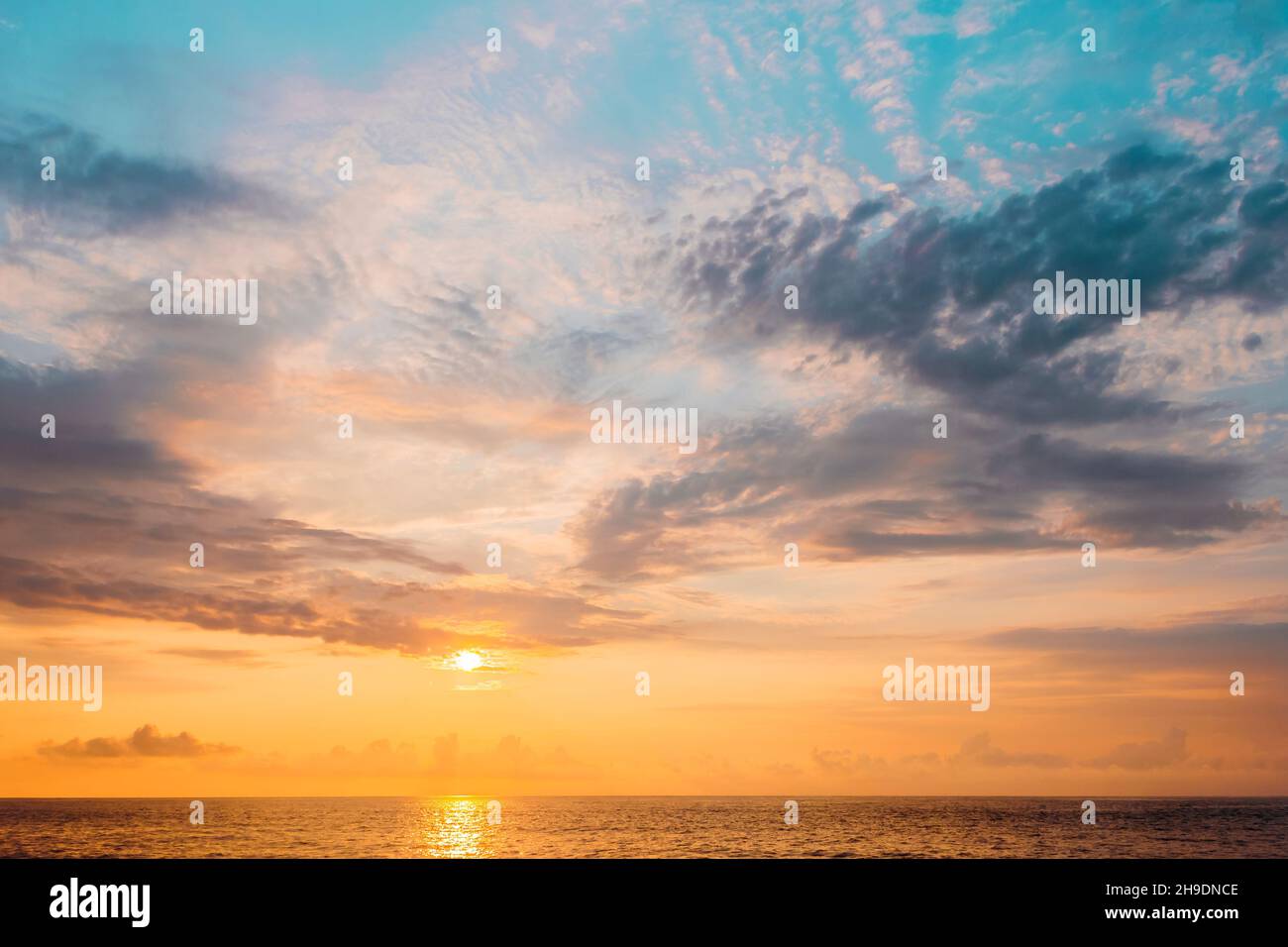 Colorful landscape, clouds and a small wave at sea Stock Photo - Alamy