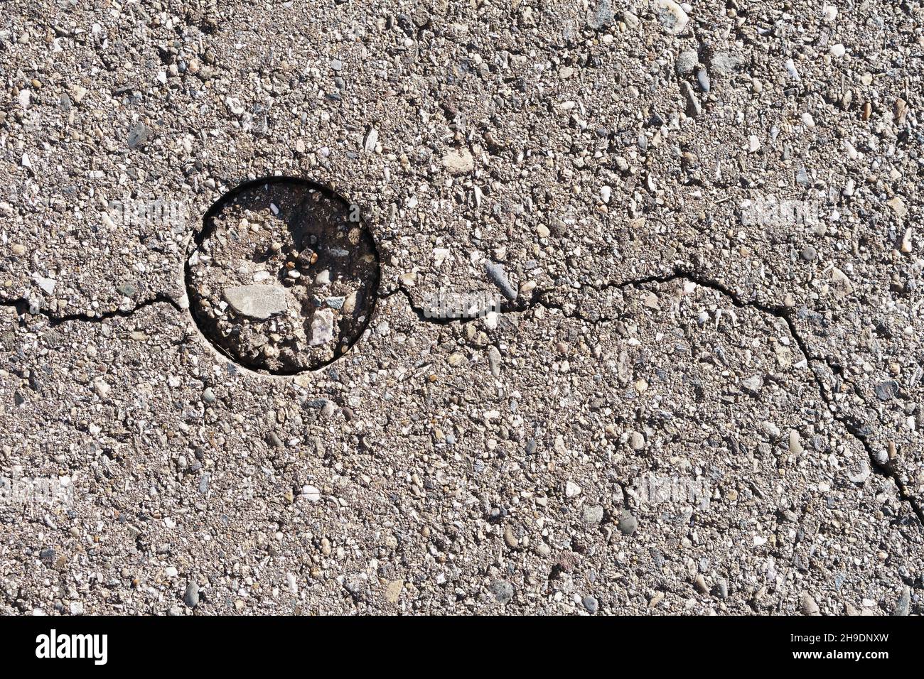 Concrete texture with crack in full screen as background. View from ...