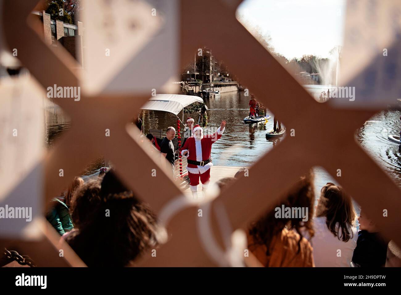 Santa arrives at Lake Anne on a barge 2021 Stock Photo - Alamy
