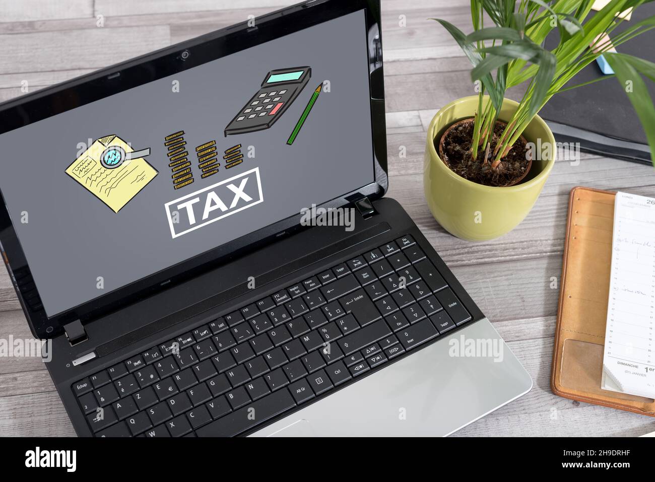 Laptop screen with tax concept Stock Photo - Alamy