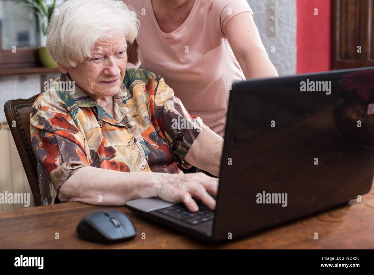 Old woman learning to use a laptop Stock Photo - Alamy