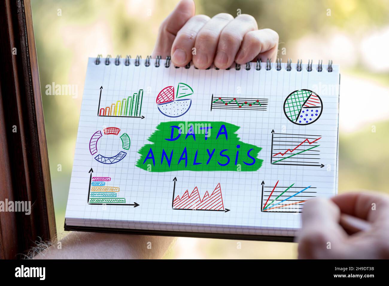 Hand drawing data analysis concept on a notepad Stock Photo - Alamy