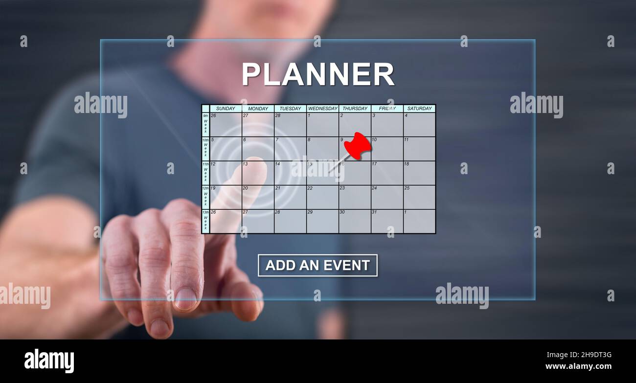 Man touching an event adding on planner concept on a touch screen with ...