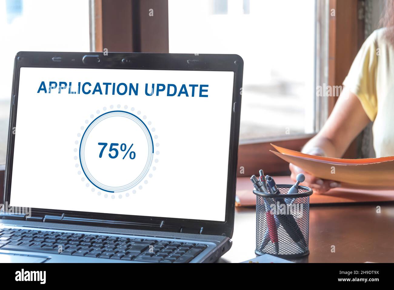 Laptop screen displaying an application update concept Stock Photo - Alamy
