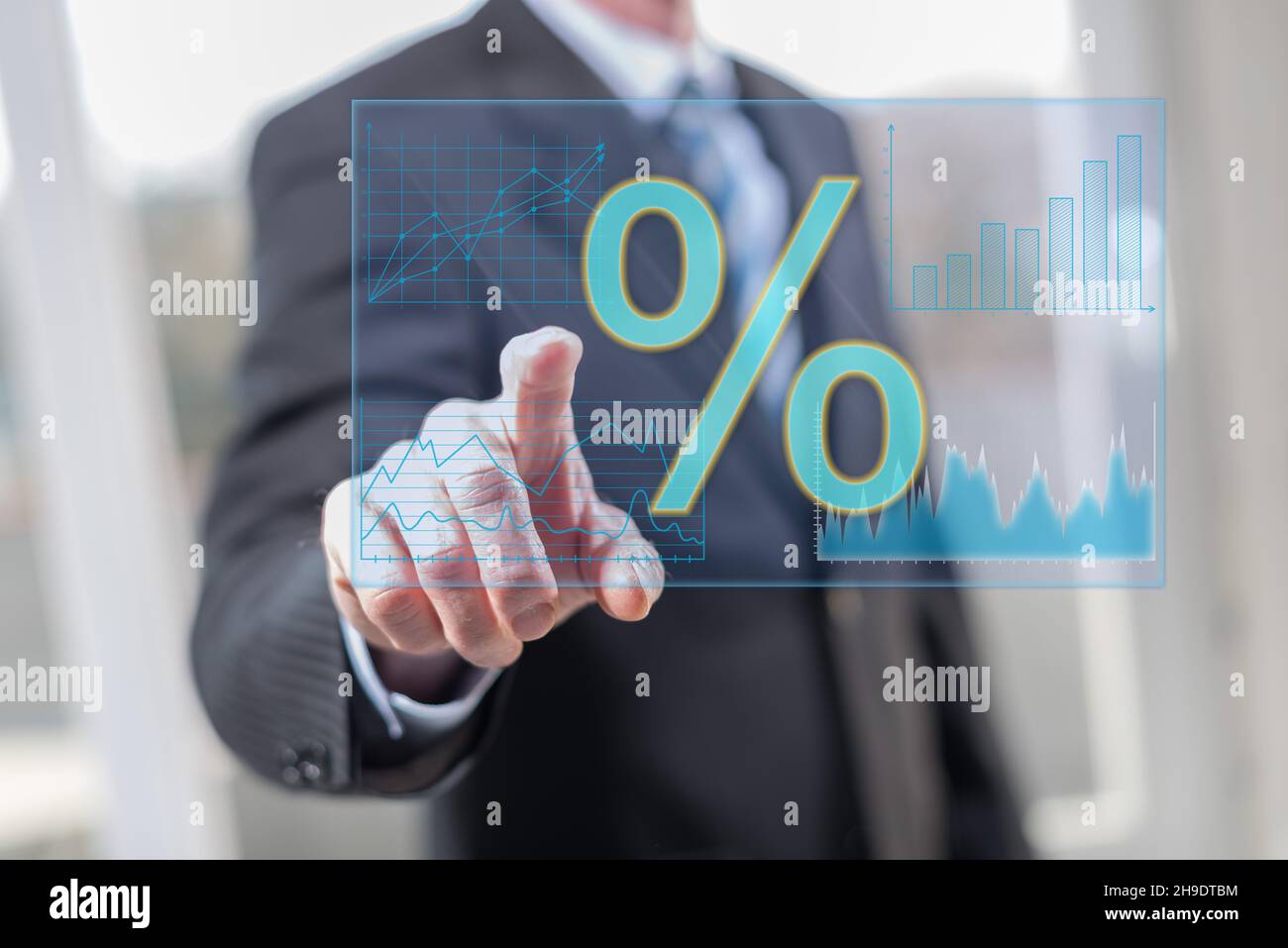 Man touching digital interest rates data on a touch screen with his ...