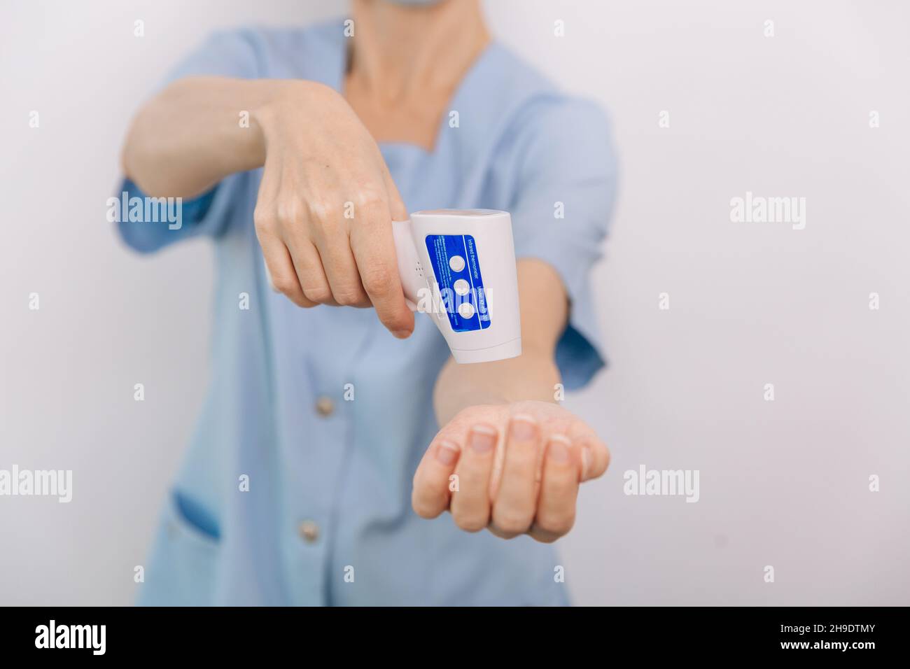 Temperature measurement gun in doctor hands. Close-up shot of doctor ...
