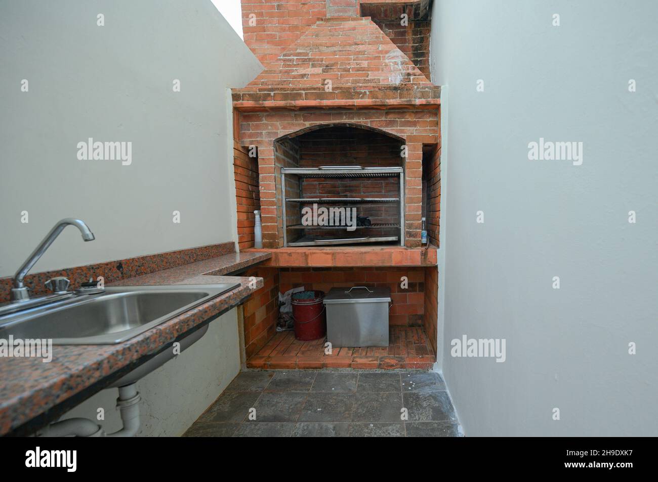 Red brick BBQ corner. Photo of open fire place wide angel. Picnic zone ...