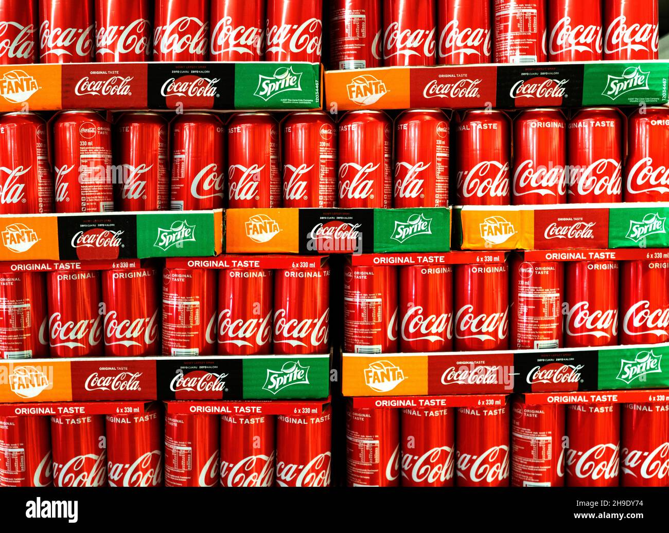 In this photo illustration, cans of Coca-Cola soft drink seen displayed ...