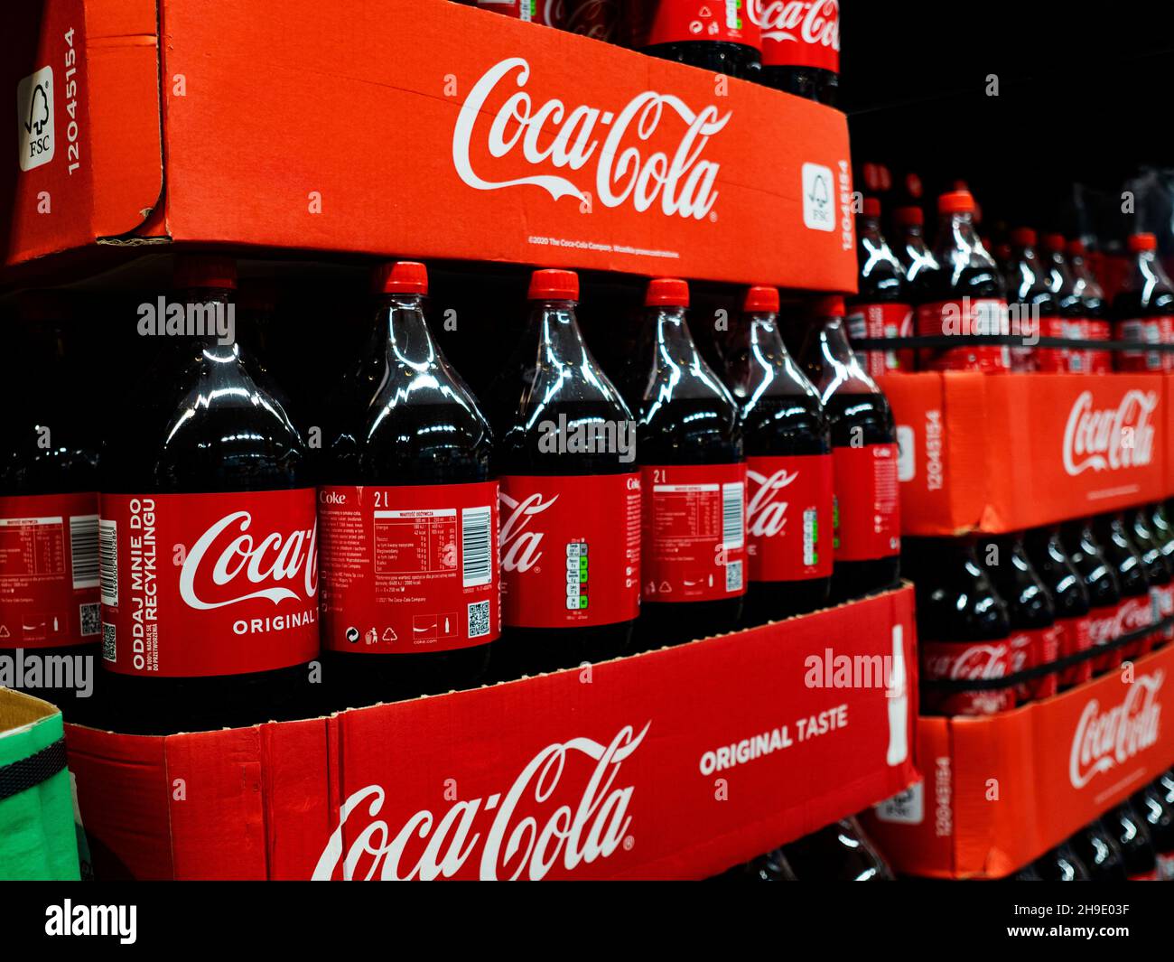 In this photo illustration, bottles of Coca-Cola soft drink seen ...