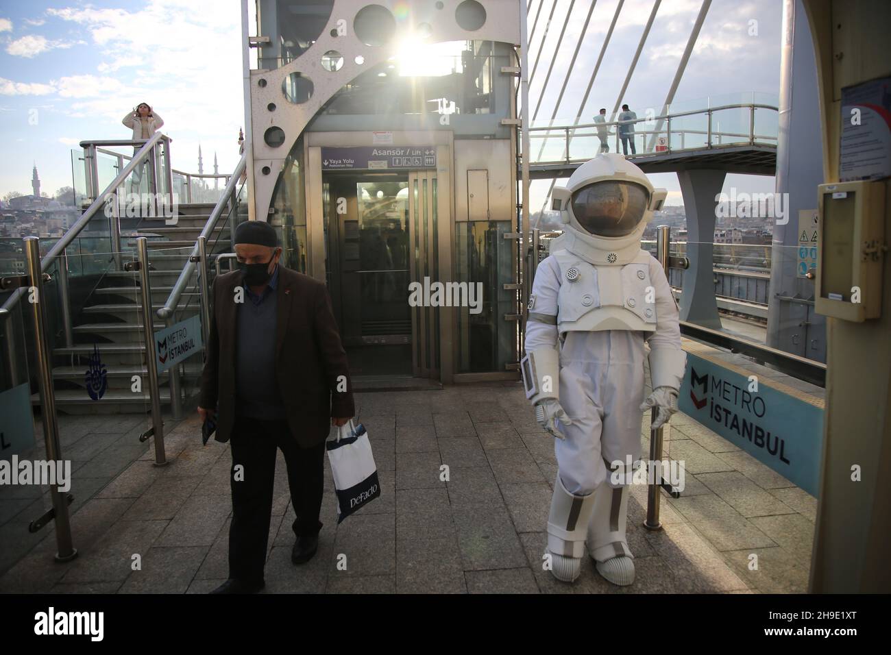 A man dressed as an astronaut is seen at the Golden Horn metro station ...